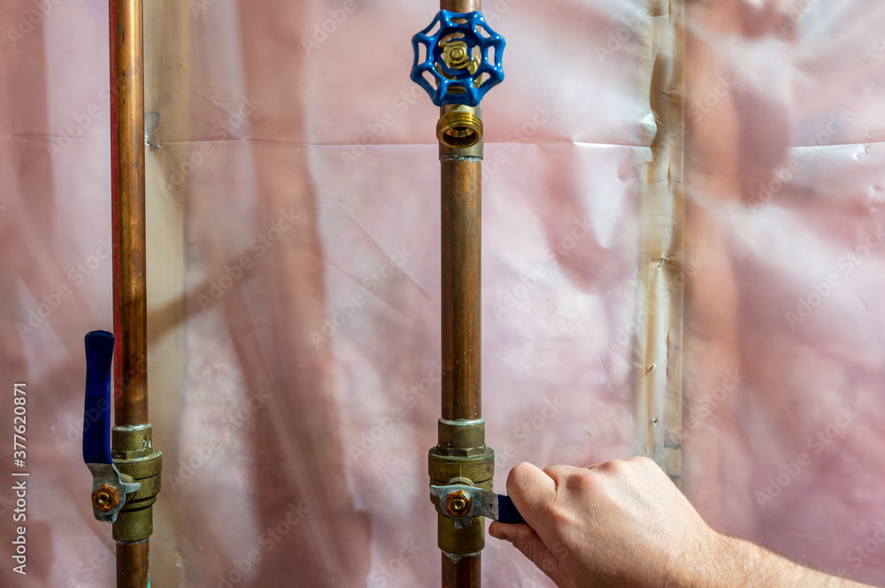 Lawn sprinkler shut off valve inside residential basement Stock Photo ...