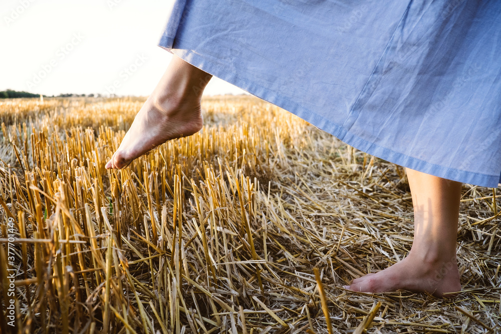 Overcome obstacles depression concept. A woman's bare foot makes a step ...