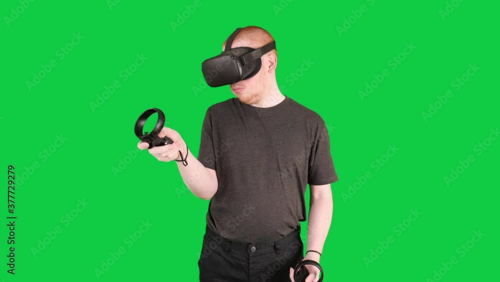 Greenscreen close up, front on, teen gamer with Oculus Quest VR Headset ...