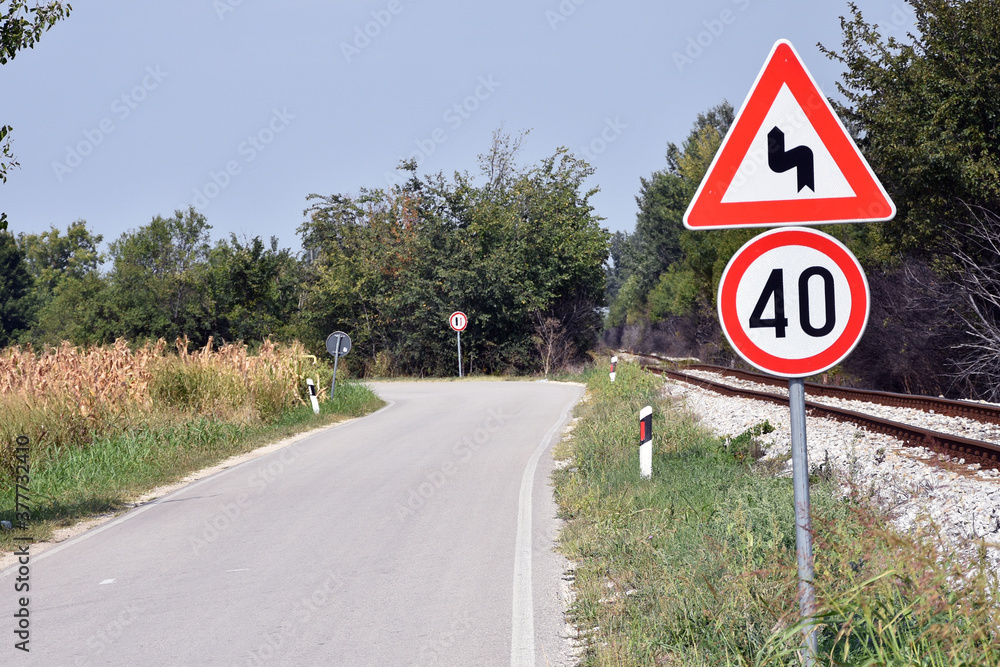 Warning sign that shows bent arrow that warns drivers on approaching ...