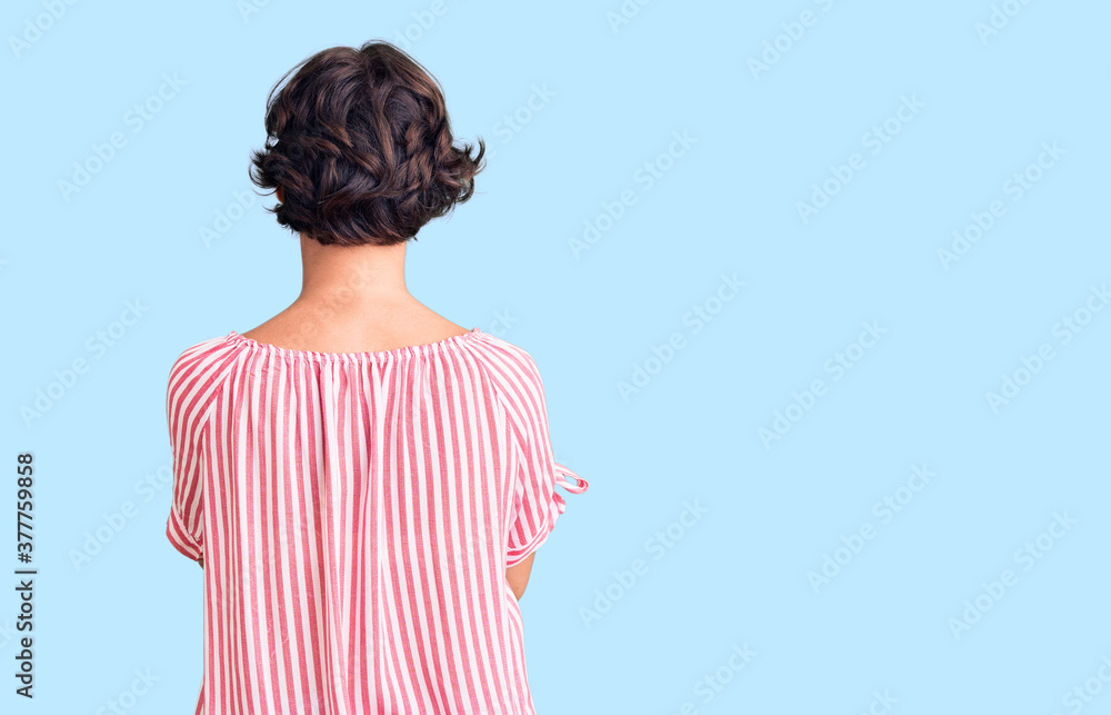 Beautiful young woman with short hair wearing casual summer clothes ...
