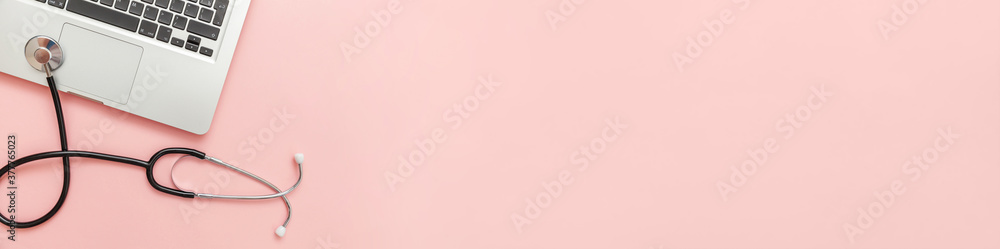Stethoscope keyboard laptop computer isolated on pink background ...