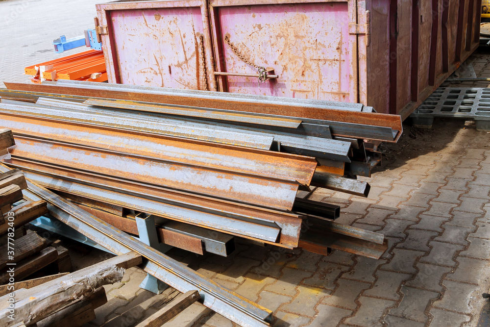 Stack of steel and rusty rail profiles. Rail cross-sections. Waste ...