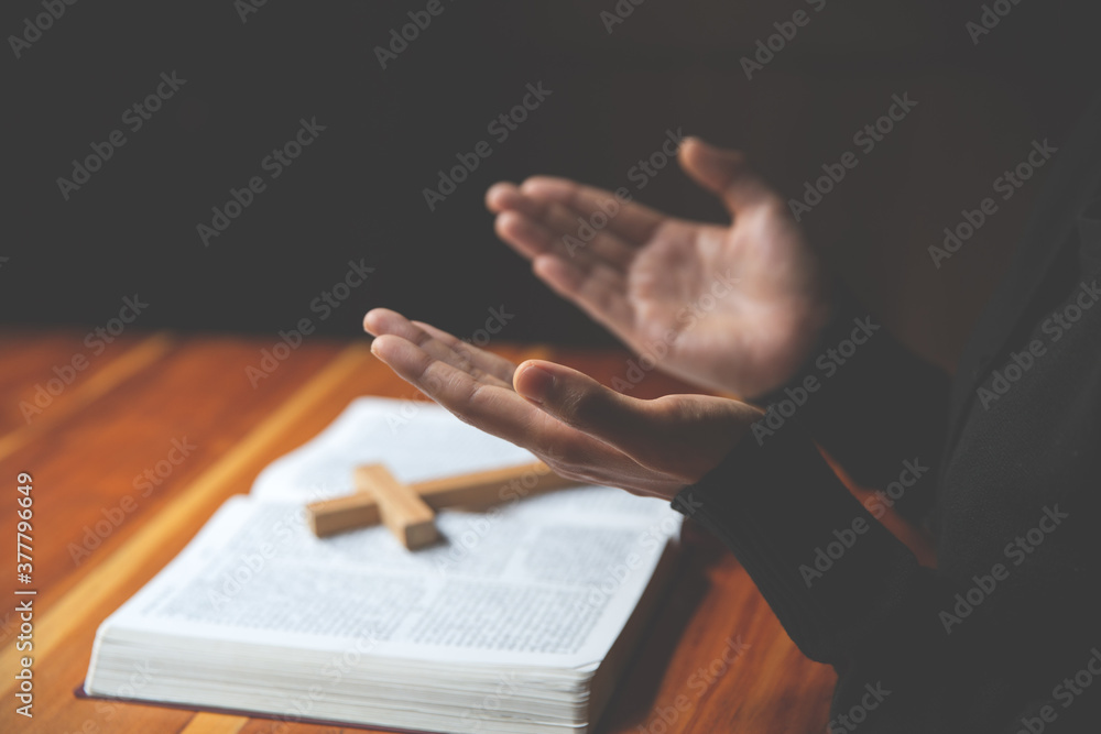 Hand of woman while praying for christian religion, Casual woman ...