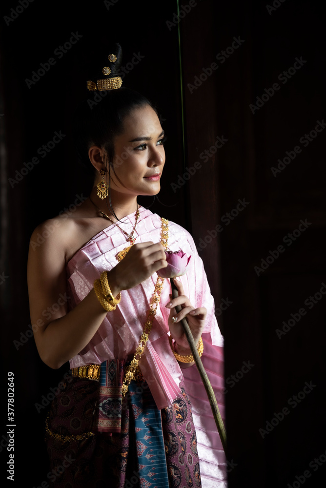 Portrait of a beautiful woman in Thai old suit or Thai national dress ...