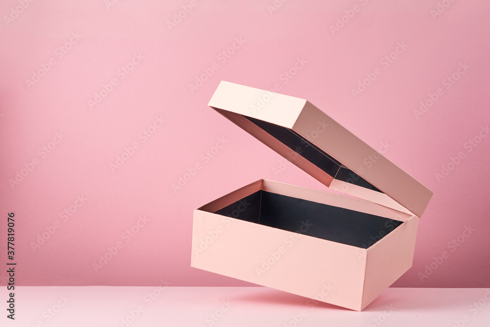 Pink open gift box isolated on pink background. Empty gift container ...