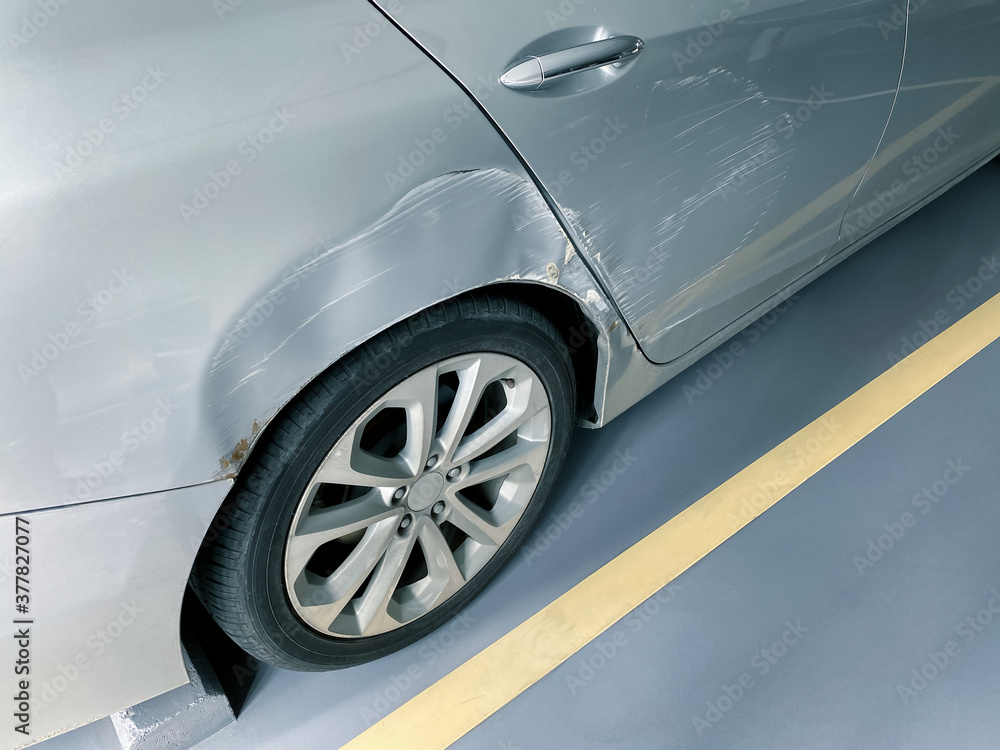 car body damage after accident, scratch and dent on body of modern car ...