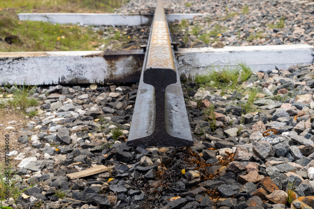 Metal railway rail. A piece of iron rail. Stock Photo | Adobe Stock