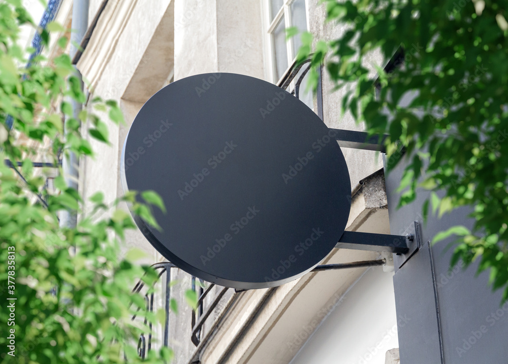 Circular store brand sign board mockup. Empty shop frontage in street ...