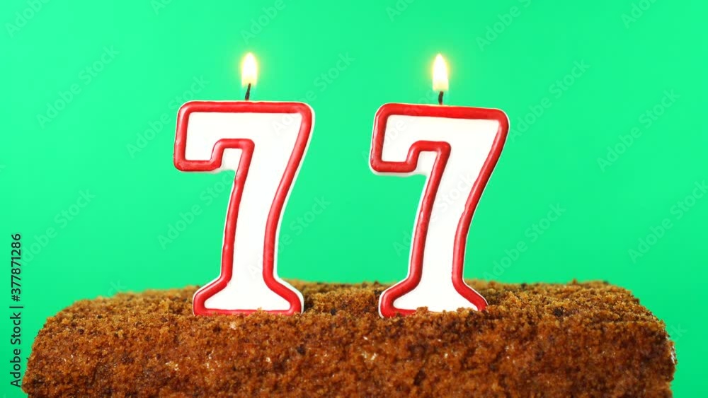 Cake with the number 77 lighted candle. Chroma key. Green Screen ...