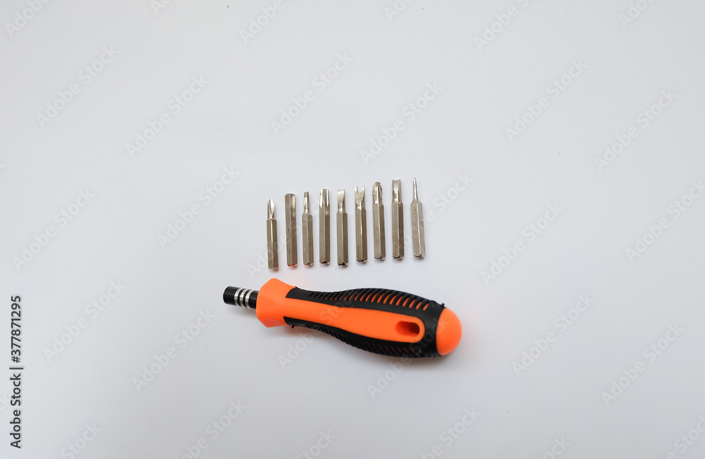 The handle of the screwdriver is a combination of orange, black and ...