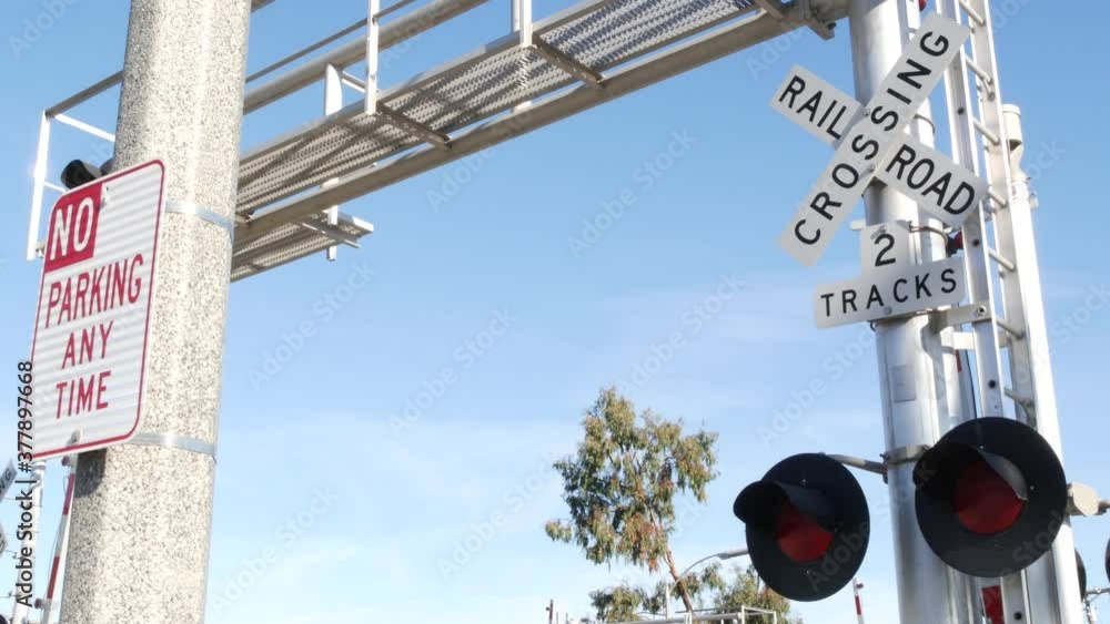 Level crossing warning signal in USA. Crossbuck notice and red traffic ...