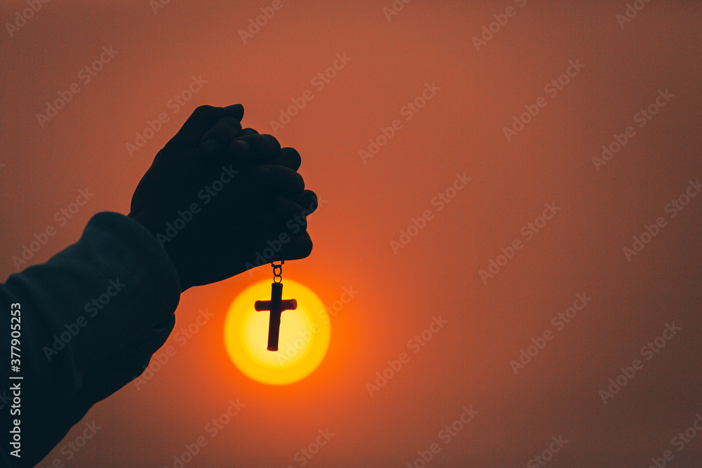 Hand holding the cross, the symbol of the blessing of Jesus, the symbol ...