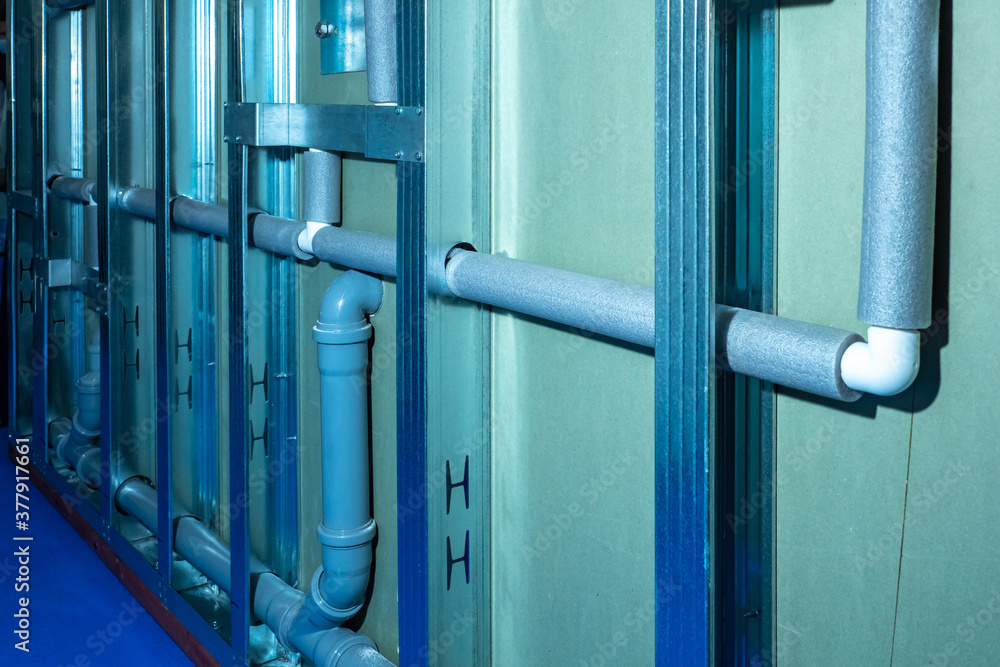 Water pipe system. Water pipes in a special frame. Installation of ...