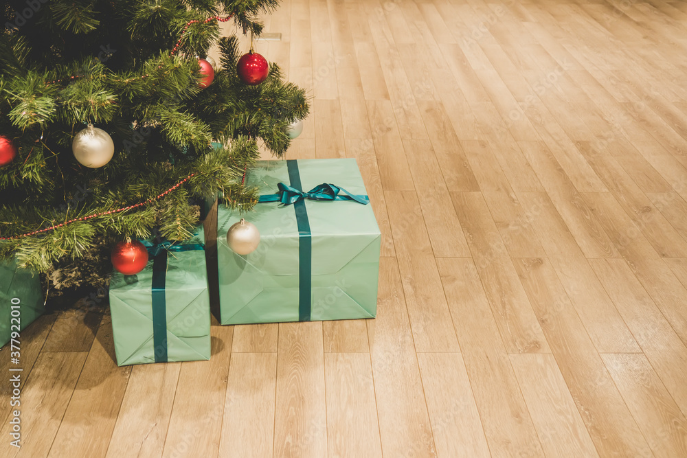 Christmas tree with decorations and presents under it interior. Blue ...