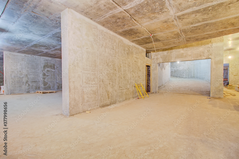 Underground parking in construction phase. Empty garage in basement of ...