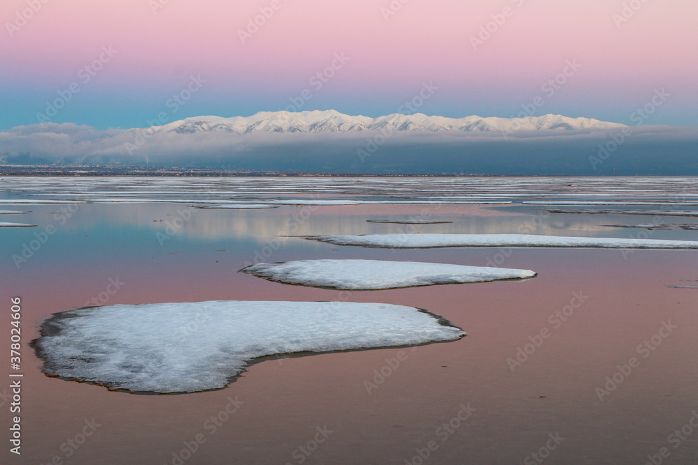 Rare frozen saltwater at the Great Salt Lake in Northern Utah. Wasatch ...