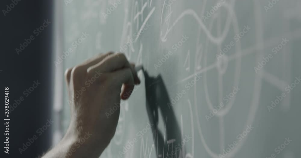 Creative mathematician writing formulas on the chalkboard Stock Video ...