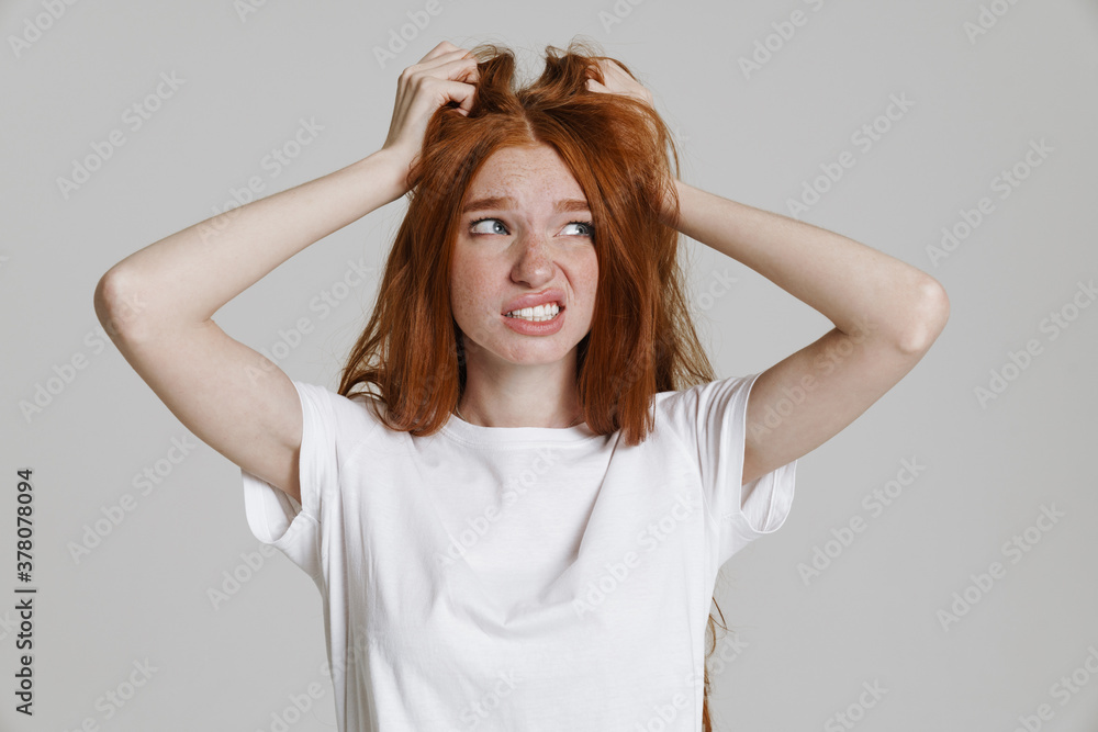 Image of confused ginger beautiful girl grabbing her head Stock Photo ...