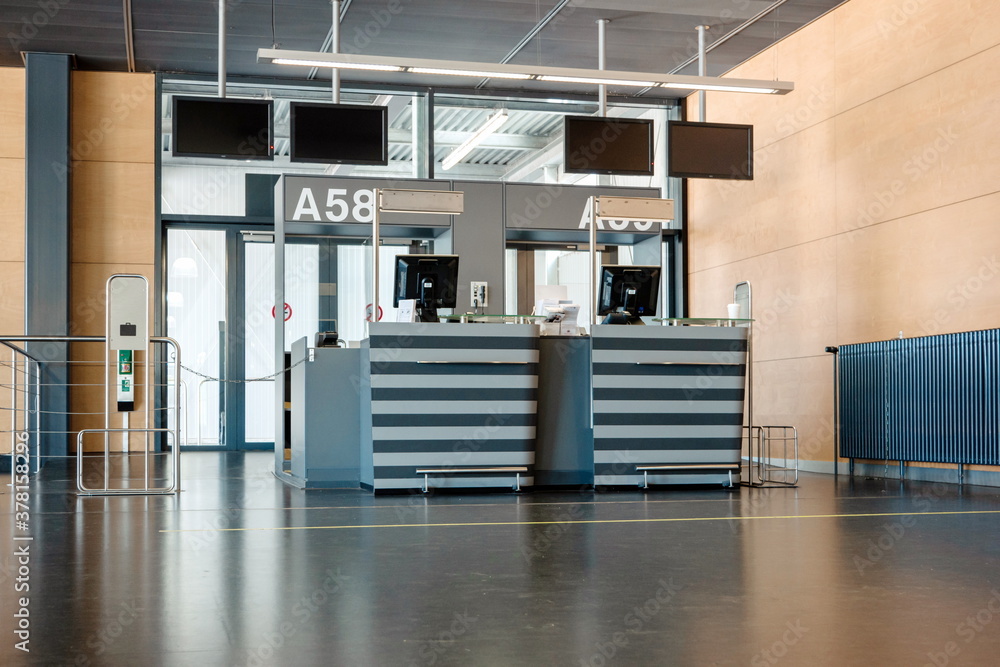 Empty international airport gate front desk with numbered signs in peak ...