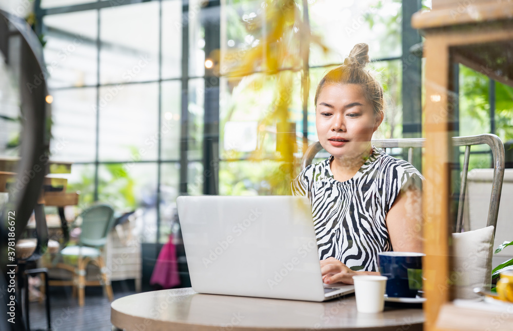 Lifestyle, Asian woman smiling sitting using laptop working in coffee ...