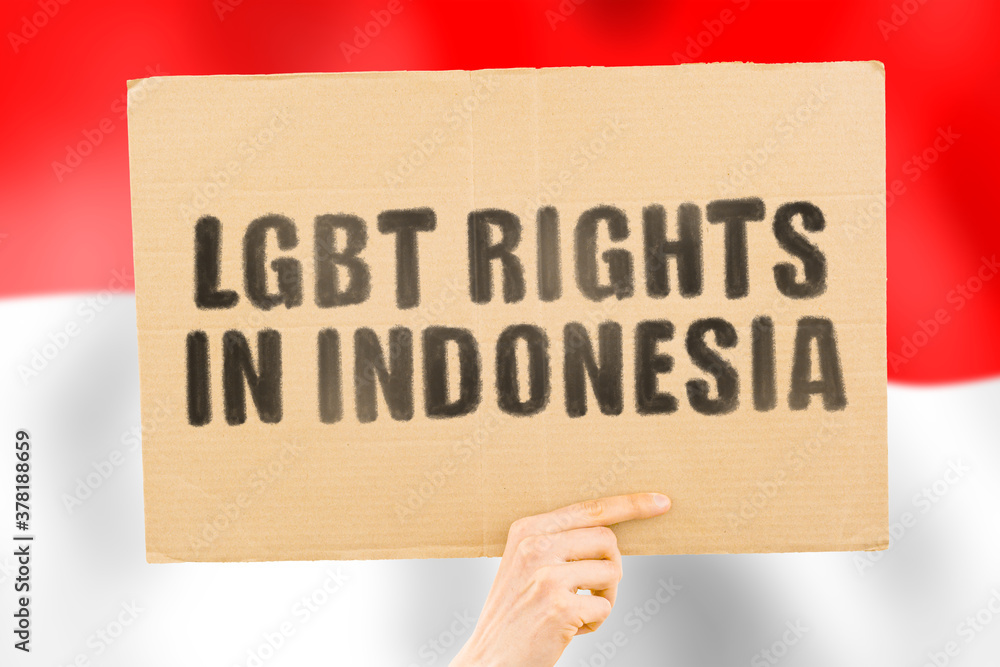 The phrase " LGBT rights in Indonesia " on a banner in men's hand with ...