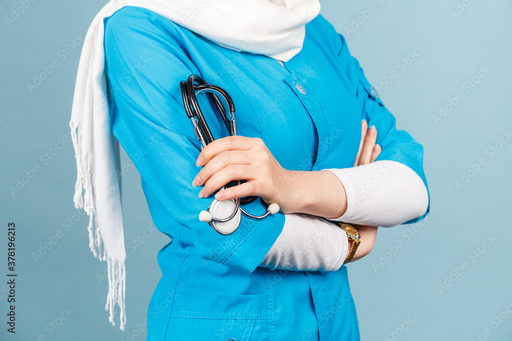 Portrait of a friendly, muslim doctor or nurse woman in hijab with a ...