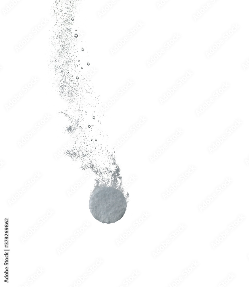 Effervescent medicine. Fizzy tablet dissolving. White round pill ...