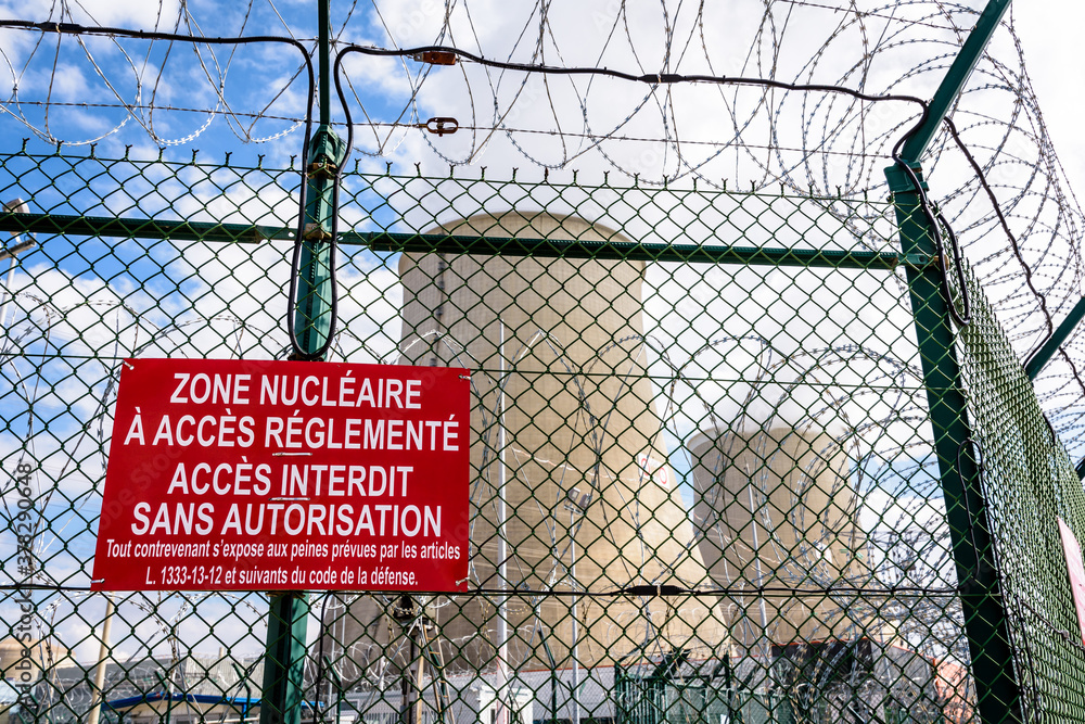 Security fence of a nuclear power plant in France with barbed wire and ...
