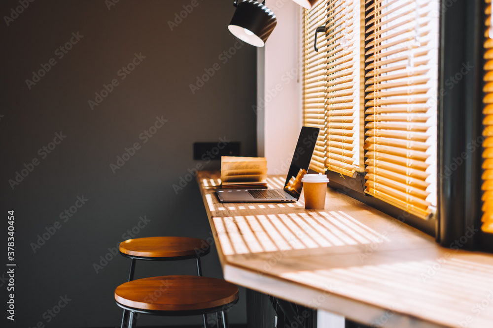 Computer laptop with coffee cup and open book on the modern wooden ...