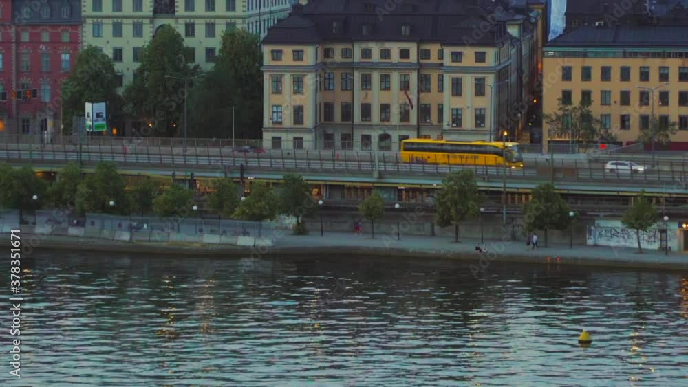 Bus and cars on city street in Stockholm. Old Town district and ...
