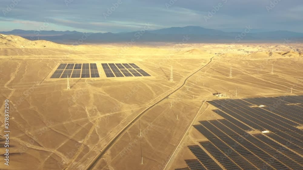 Aerial footage. Solar Energy Farm at Atacama Desert, Chile. Thousands solar modules rows passed ...