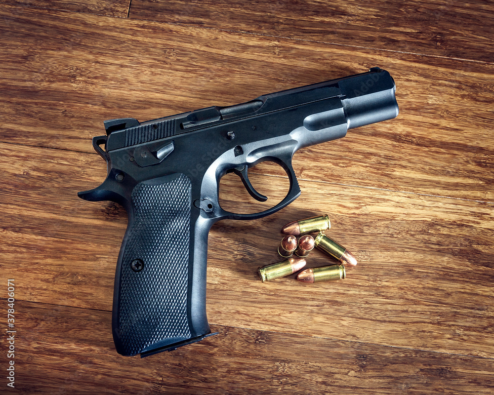 Semi automatic 9mm pistol with 9mm rounds cartridges with a wood ...