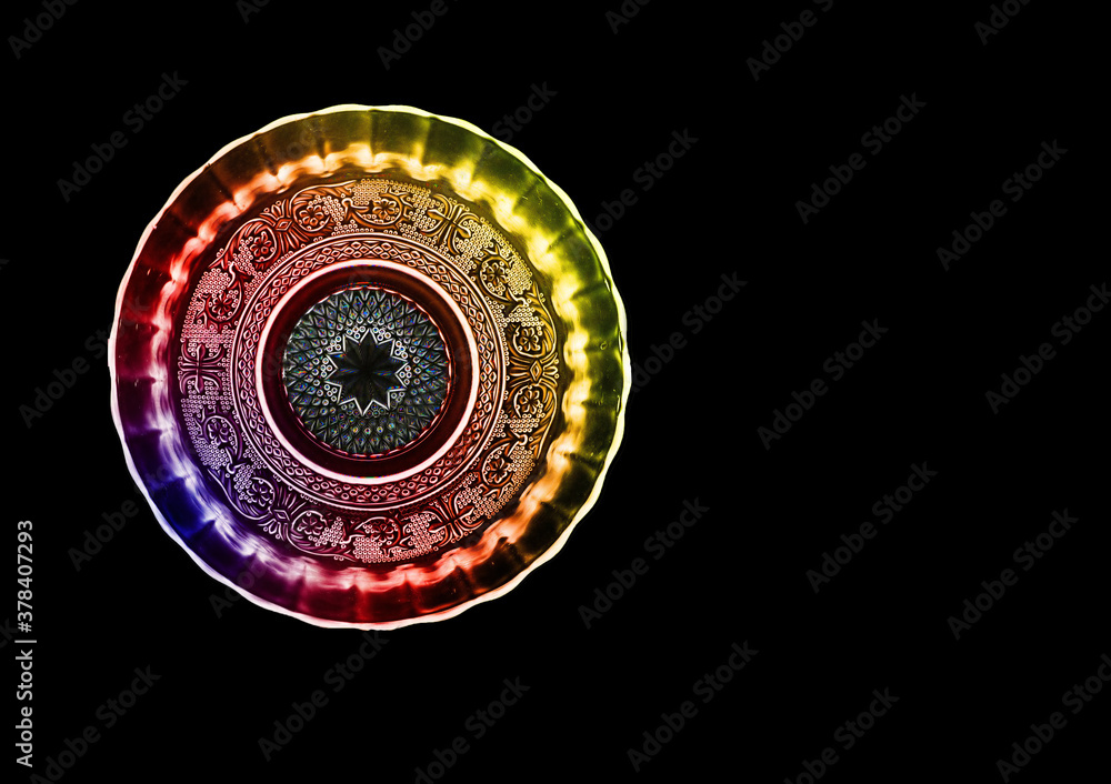 Designer Glass plate with back light in a black background with space ...