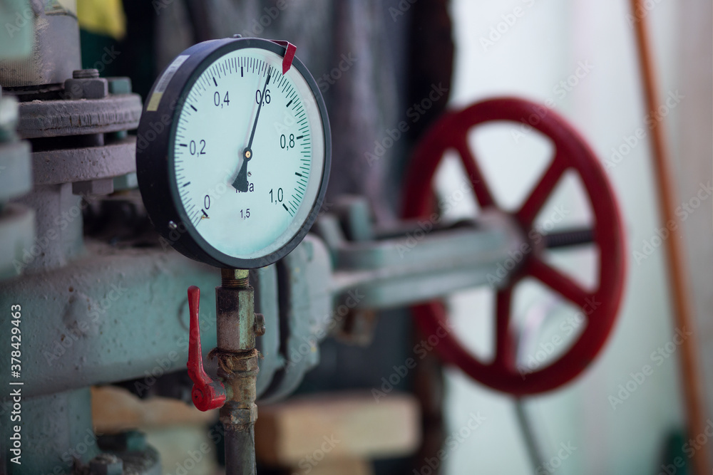 Manometer installed on the pipeline. Pressure gauge in pipes. A device ...