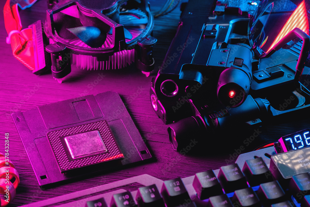 Cyberpunk concept background. Floppy disk, guns, computer keyboard, cpu ...