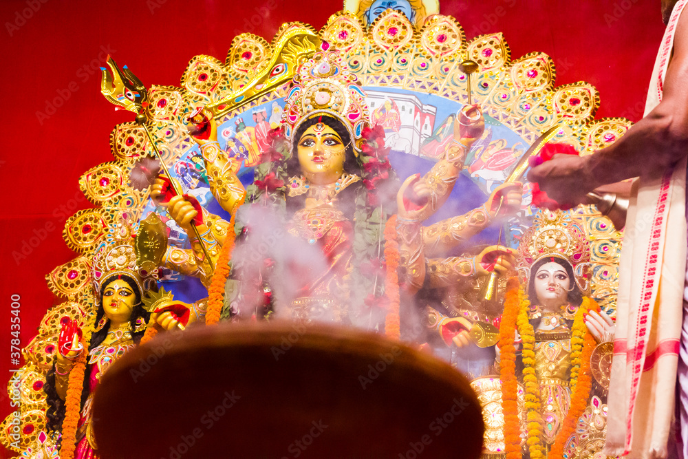 hazed picture of goddess durga in background of smoke of worship Stock ...