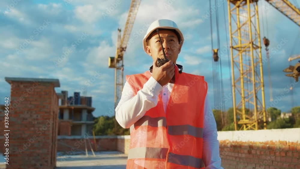 Portrait asian man builder engineer worker in hard hat with use a ...