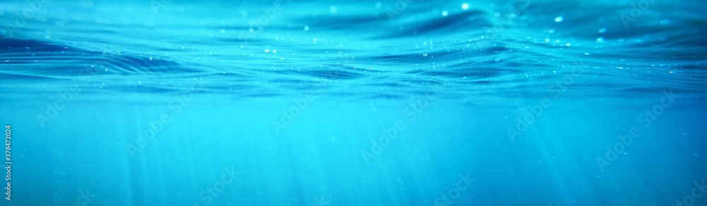 Picturesque panoramic underwater view. Sunbeams in turquoise water ...