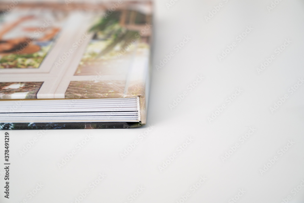 close up. photo book binding. storing photos from a photo session in a ...