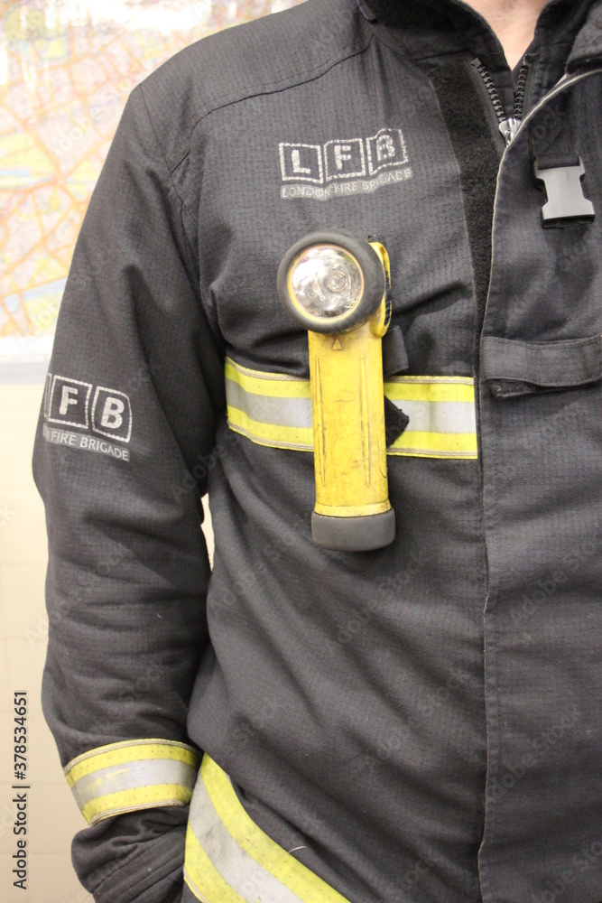London fire brigade uniform firefighter - LFB, torch Stock Photo ...