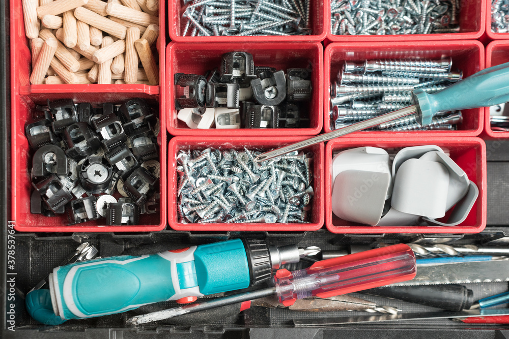 Toolbox with different instruments. Screws and screwdriver Plactic box ...