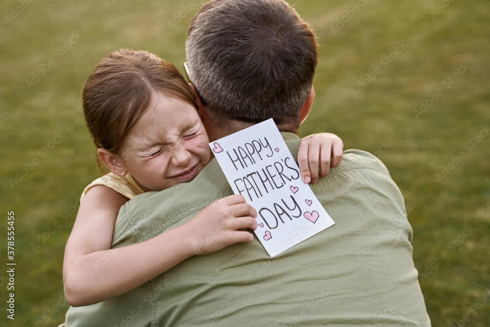 I love you, daddy. Cute happy little girl, small daughter hugging her ...