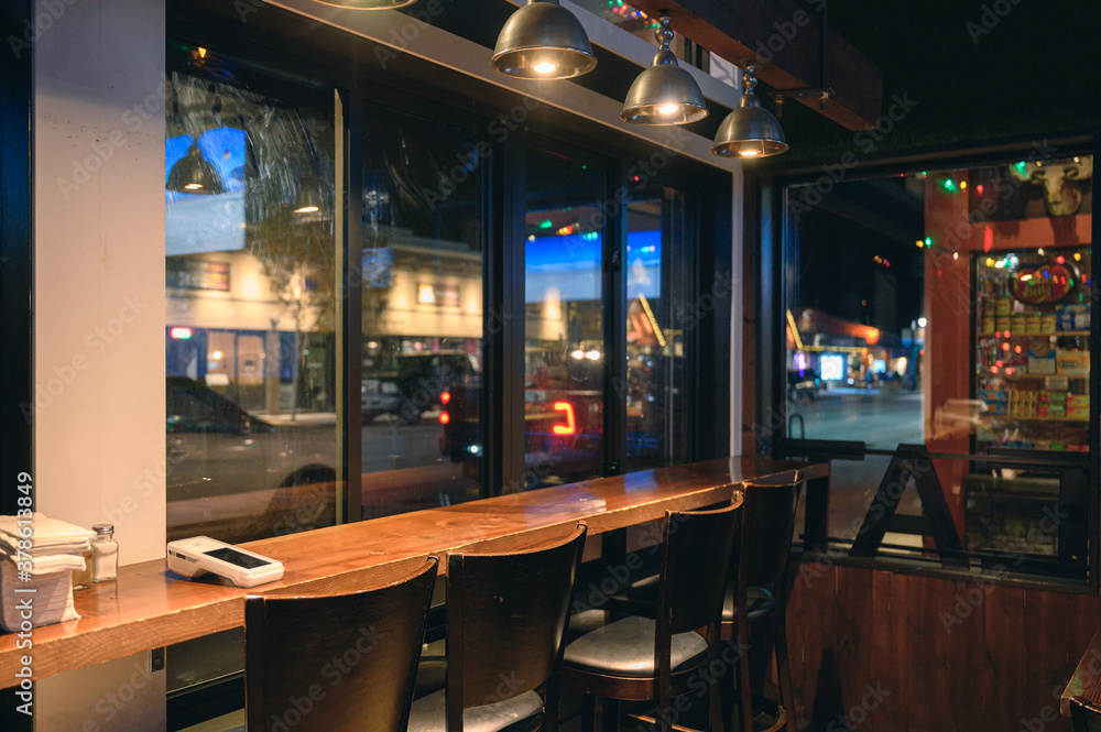 Inside of restaurant with wooden bar with lighting shine in the city on ...
