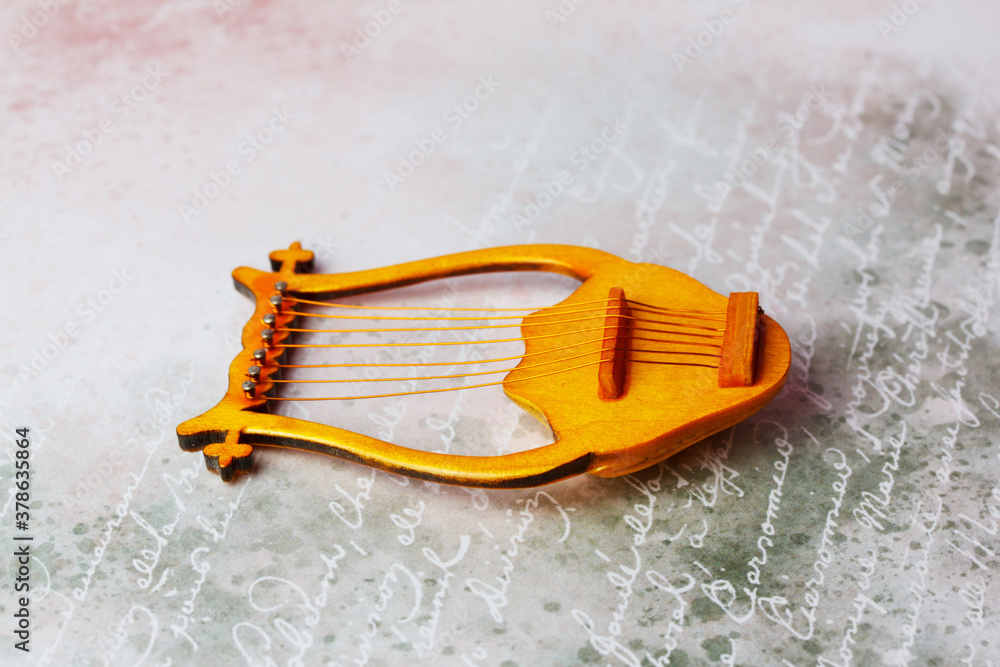 lyre - stringed plucked musical instrument . A symbol of poetry, poetic ...