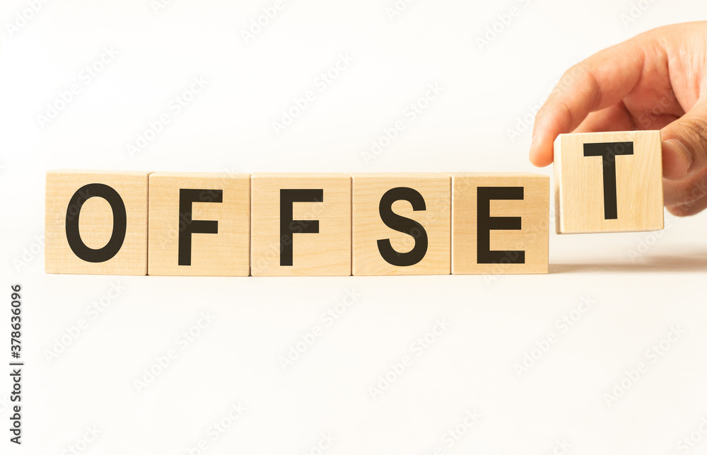Word offset. Wooden small cubes with letters isolated on white ...