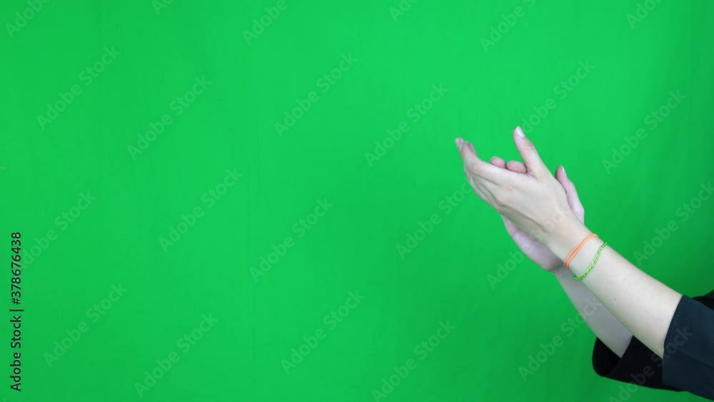 Woman hands arms clapping applause bravo gesture isolated over green ...
