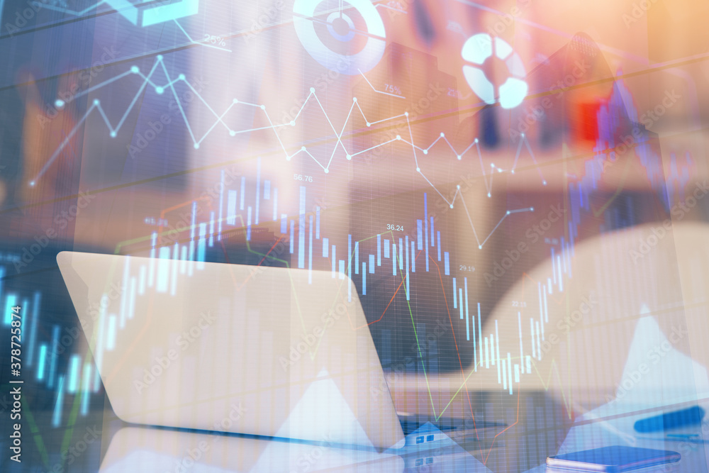 Stock market graph on background with desk and personal computer. Multi ...