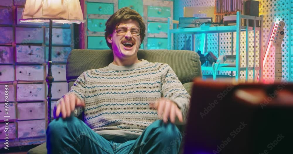 Caucasian funny young man nerd in glasses and with mustache sitting in ...