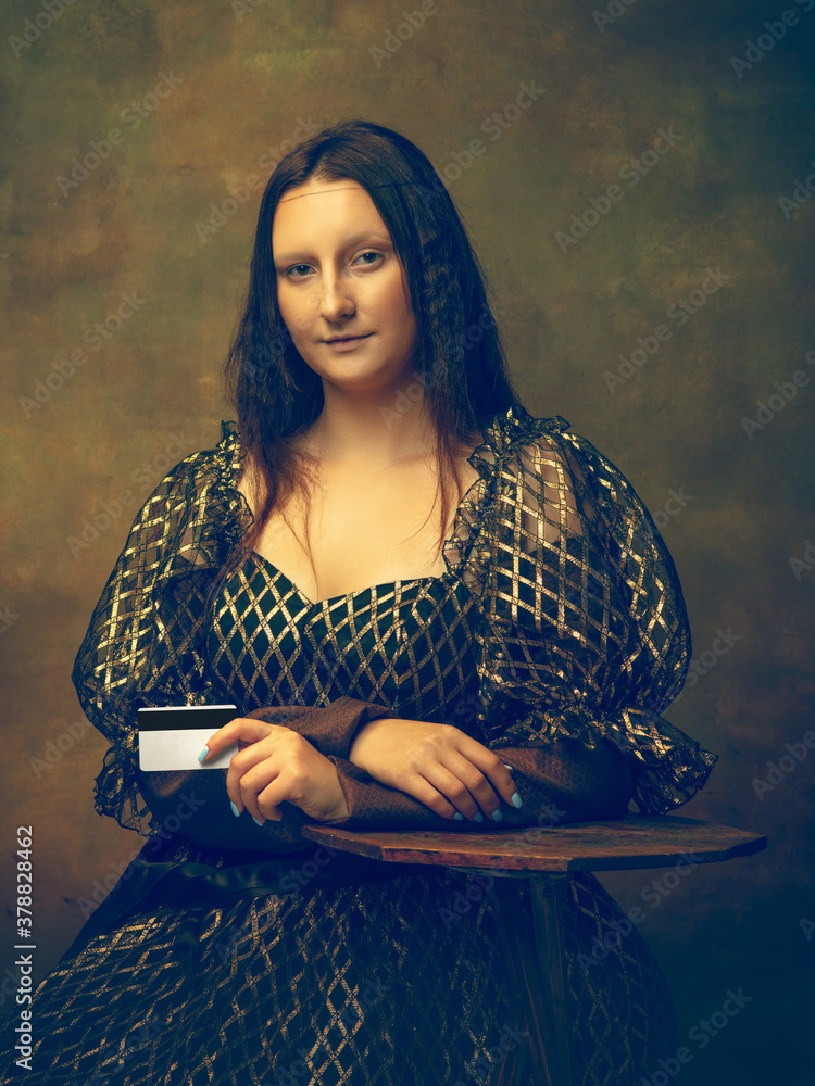 Online shop. Young woman as Mona Lisa, La Gioconda isolated on dark ...